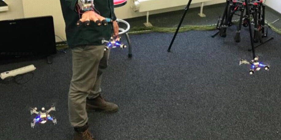 SwarmTouch: A tactile interaction strategy for human-swarm ...